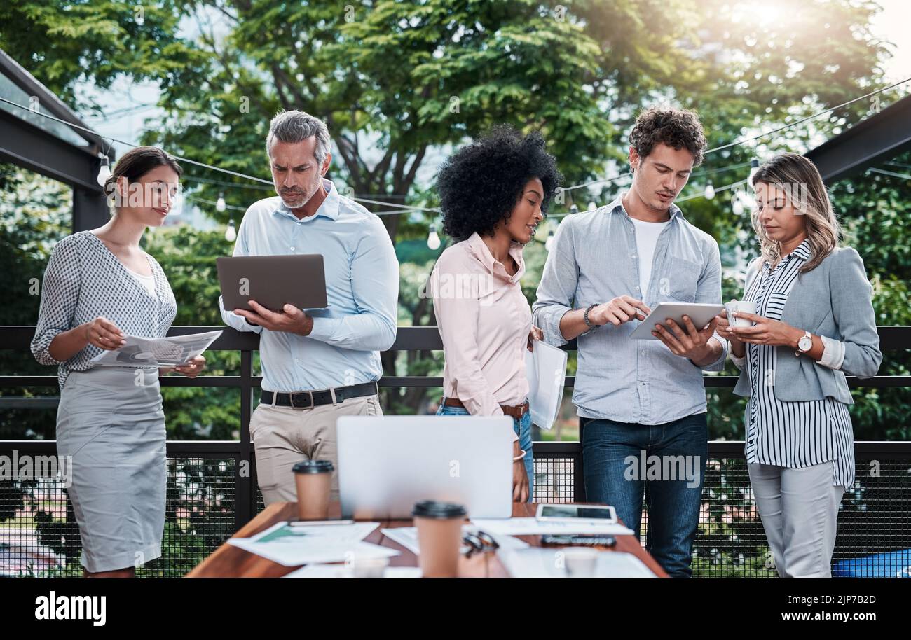 Getting things done is what they do. a group of businesspeople working ...