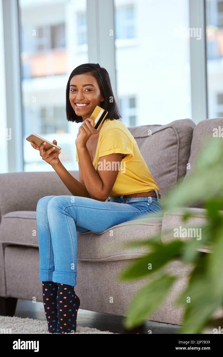 Getting tickets to my favourite show online. a teenage girl using a ...