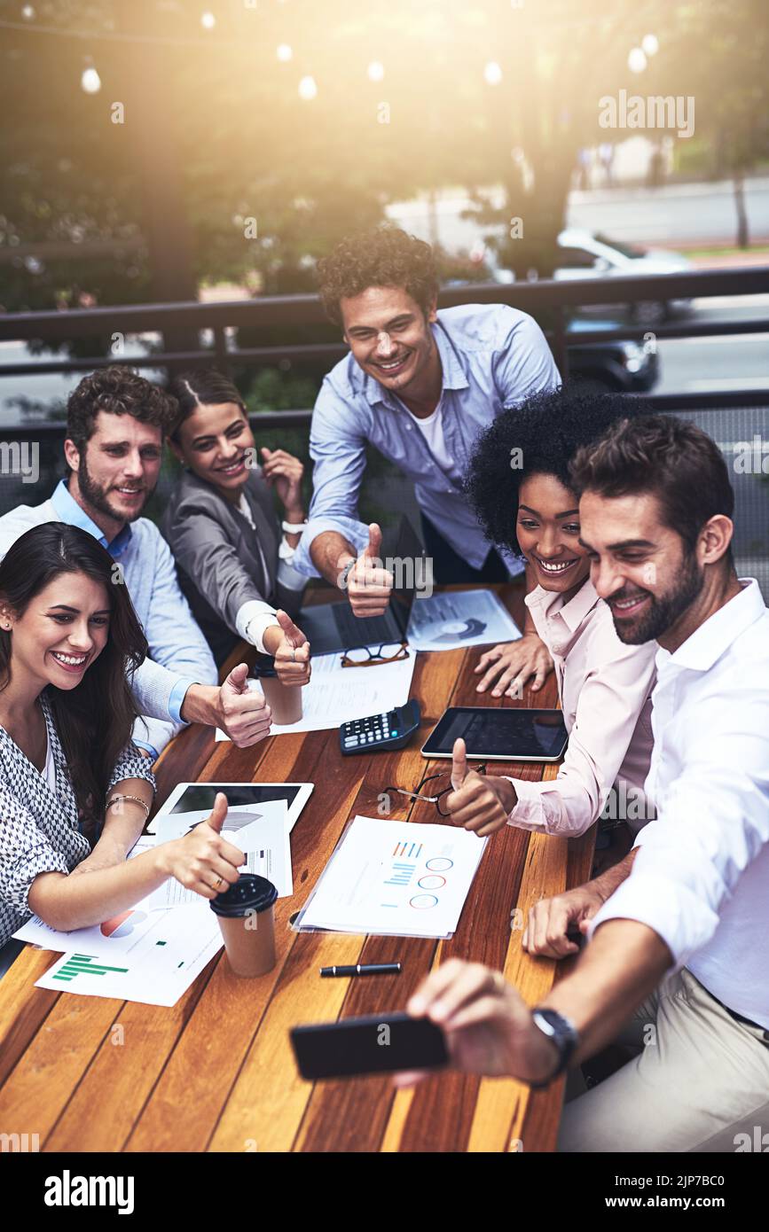 Positivity flows all around this team. a group of colleagues showing ...