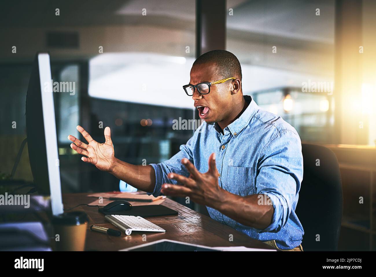 What do you mean error. a young businessman looking angry while using a ...