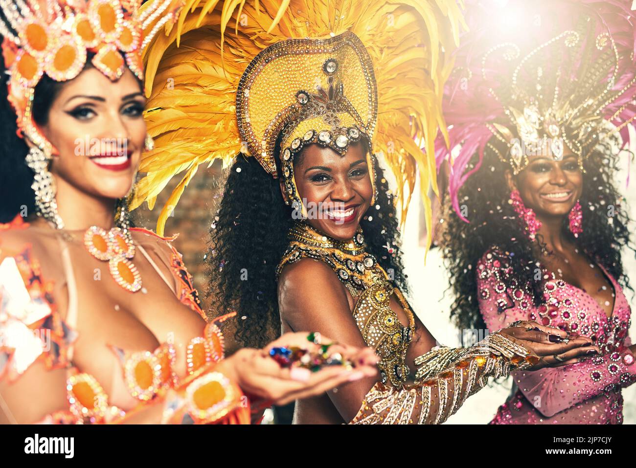 Dancing divas. Cropped portrait of three beautiful samba dancers performing at Carnival Stock ...