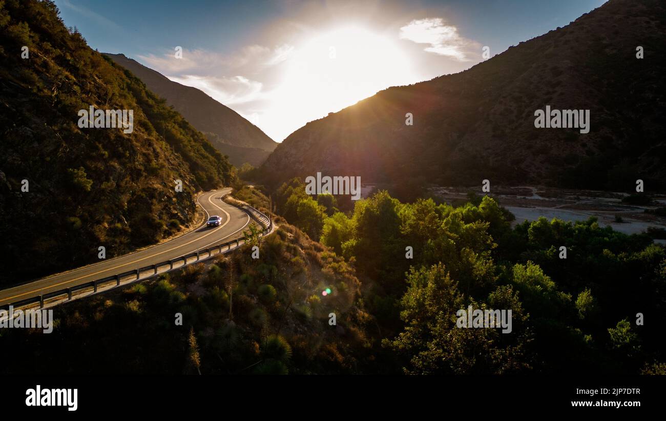 A scenic shot of a road and mountain silhouettes at Azusa Canyon in ...