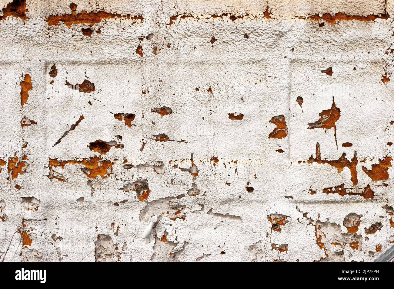 Old white foam wall with large chunks punched out of it Stock Photo - Alamy