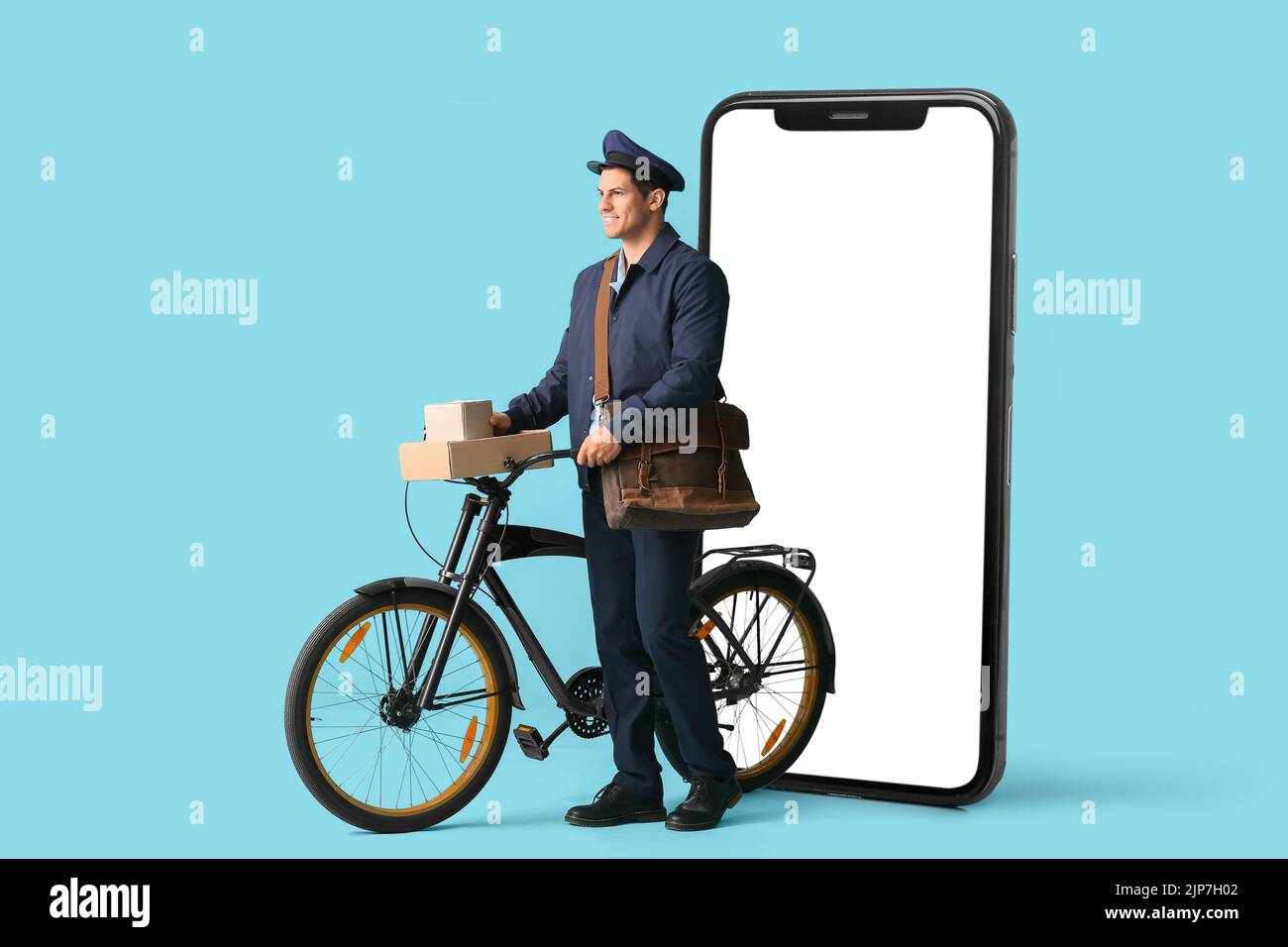 Young postman with bicycle and big mobile phone on light blue ...