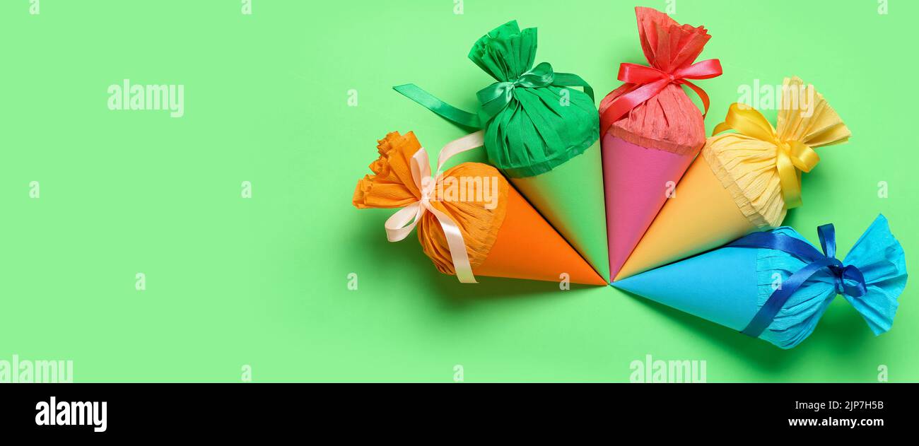 School cones on green background with space for text Stock Photo - Alamy