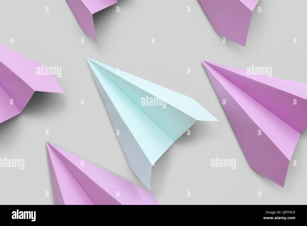 Paper planes on grey background Stock Photo - Alamy