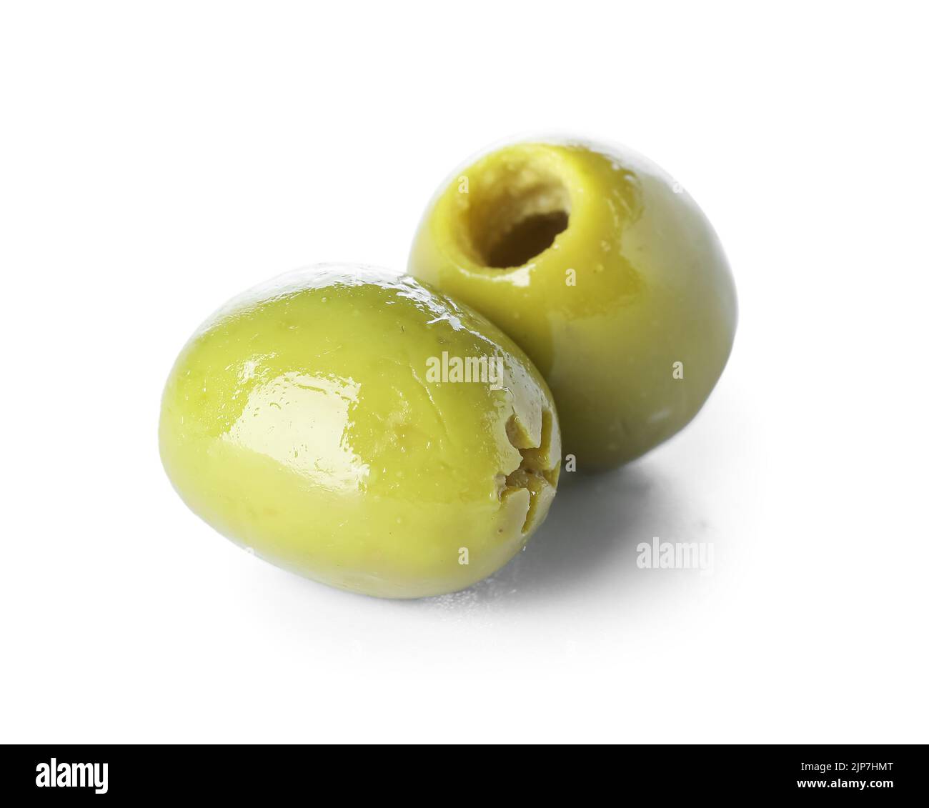 Two green olives on white background Stock Photo - Alamy