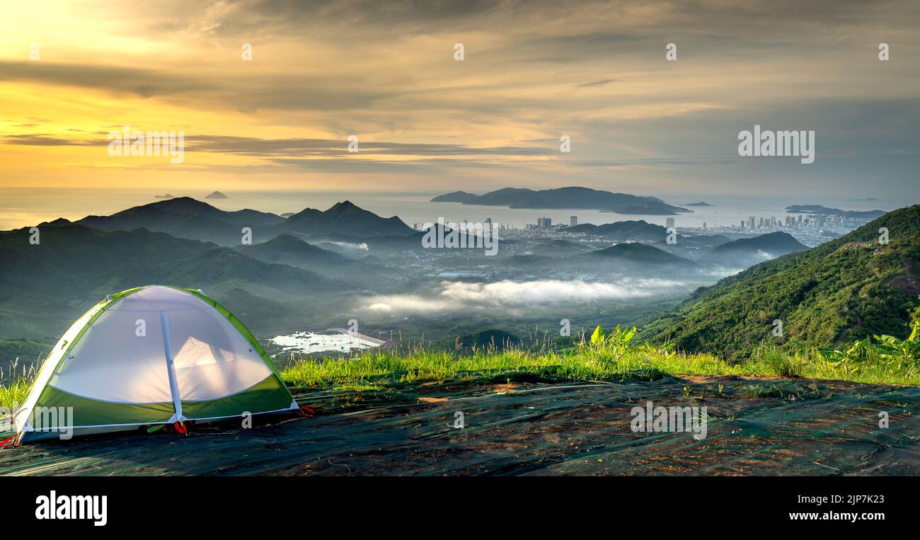 camping tent on the high mountain, looking into the distance is the ...