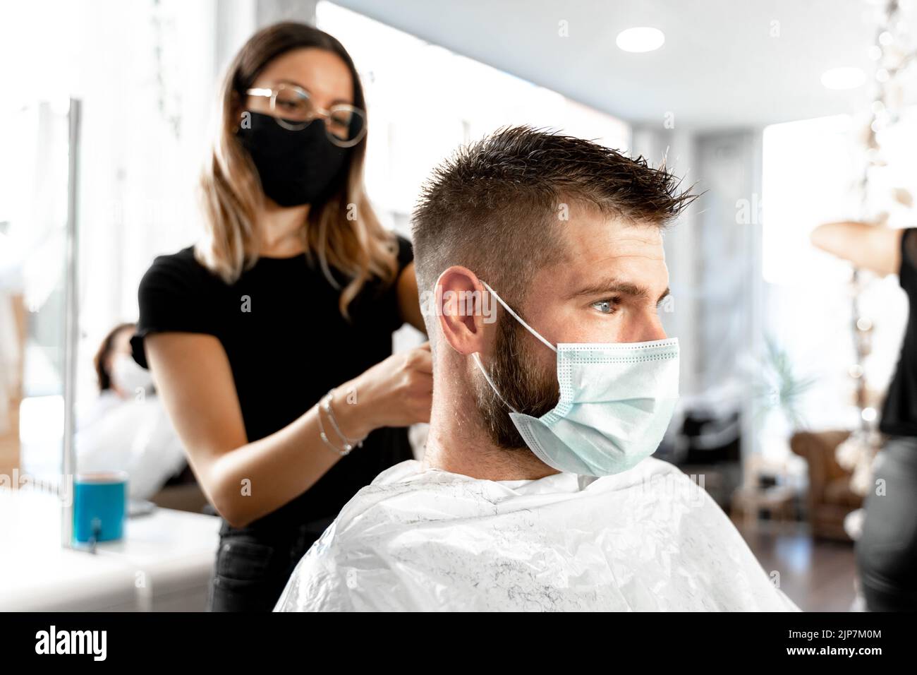 Female hairdresser customer wearing hi-res stock photography and images ...