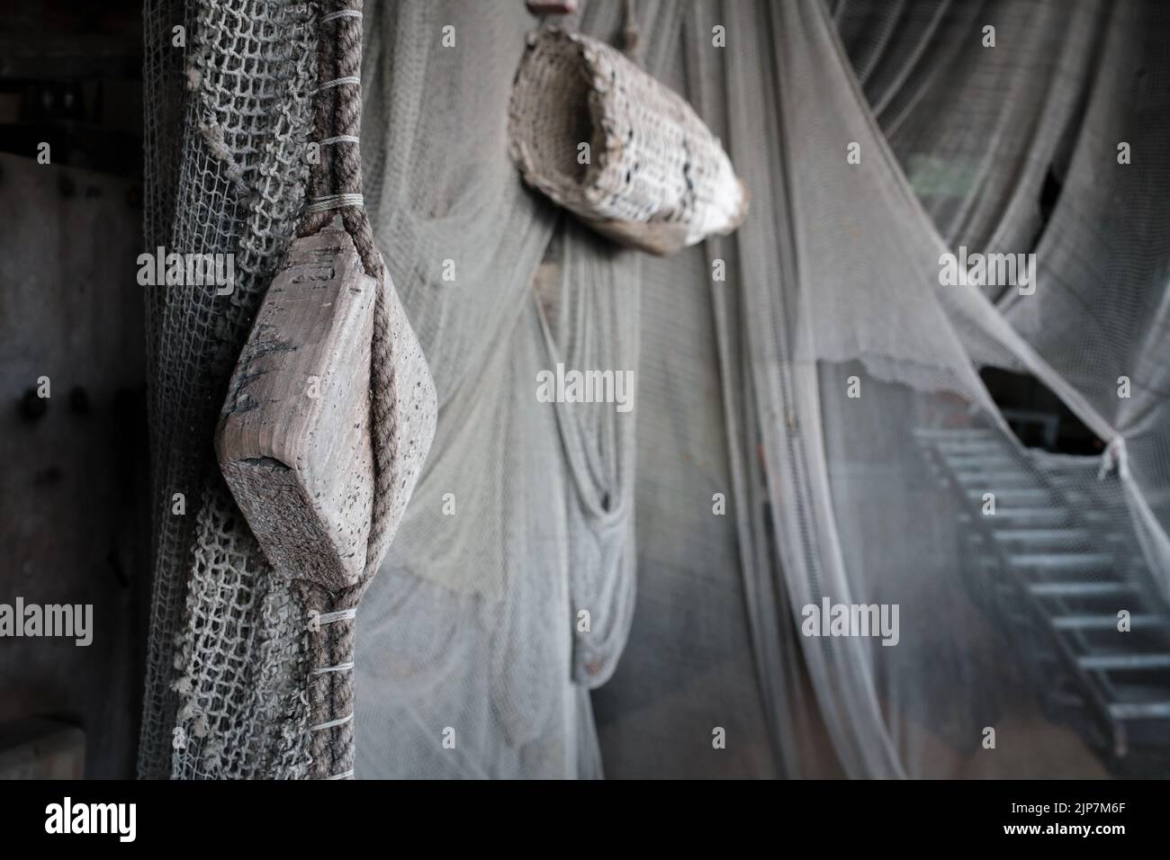 Old fishing nets hung along the walls background Stock Photo - Alamy