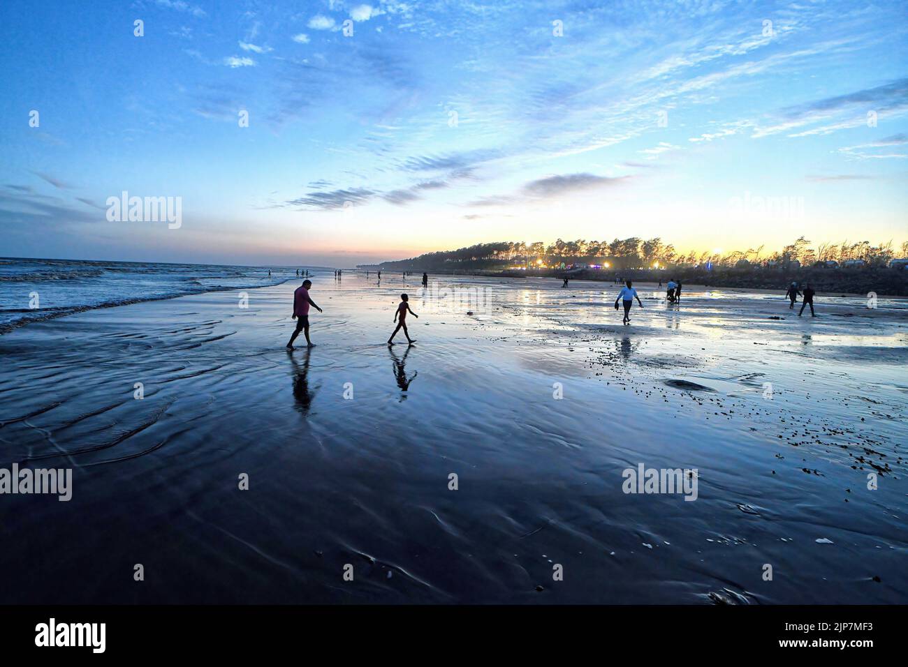 Digha, India. 15th Aug, 2022. Tourists seen walking along the sea beach ...