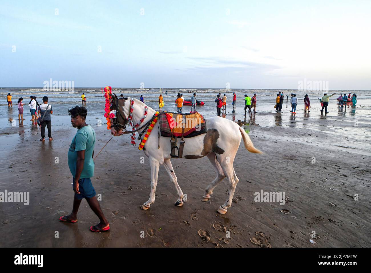 A horse rider waits for travelers at the seaside of Digha. Digha sea beach is a popular tourist ...