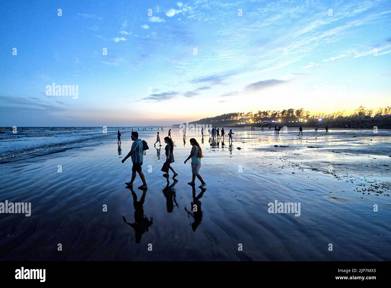 Digha, India. 15th Aug, 2022. Tourists seen walking along the sea beach ...