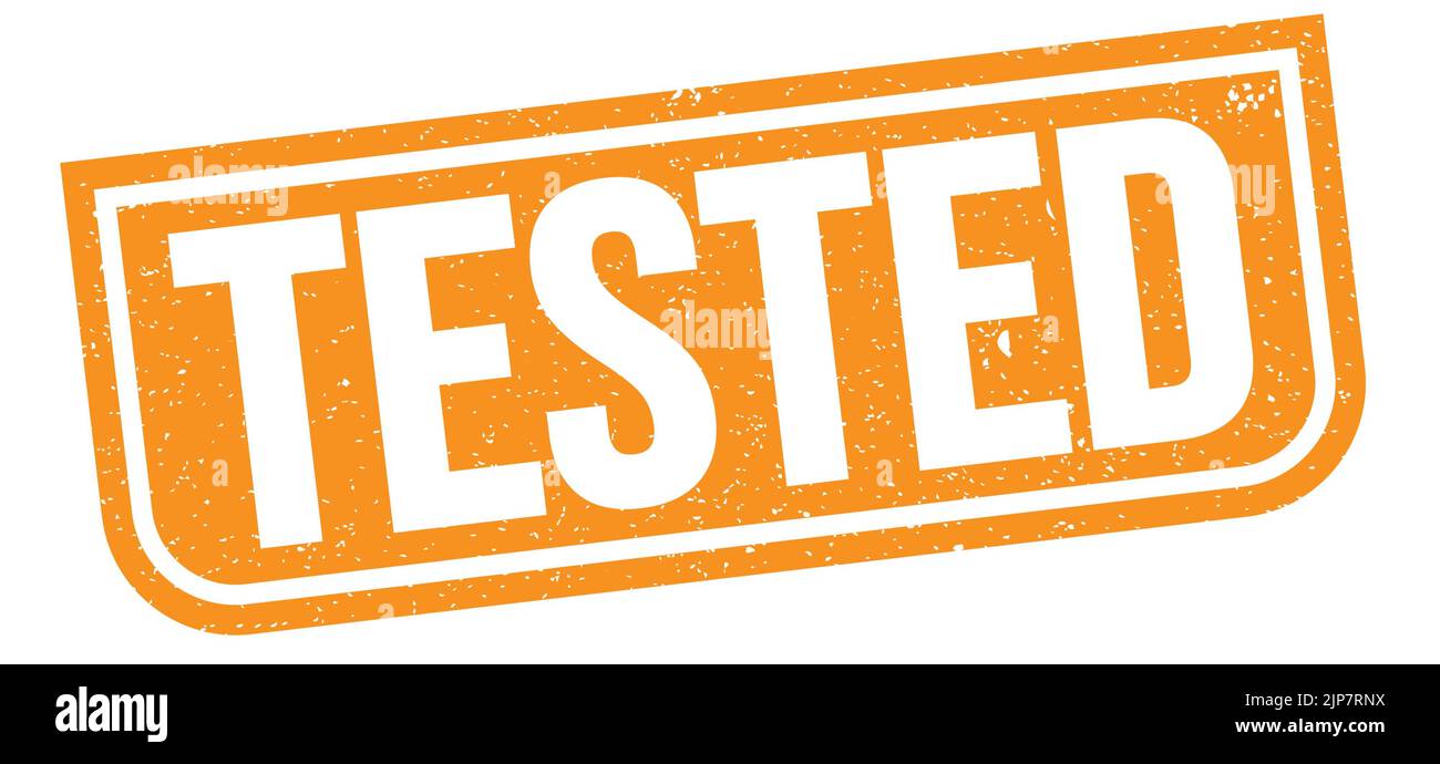 TESTED text written on orange grungy stamp sign Stock Photo - Alamy