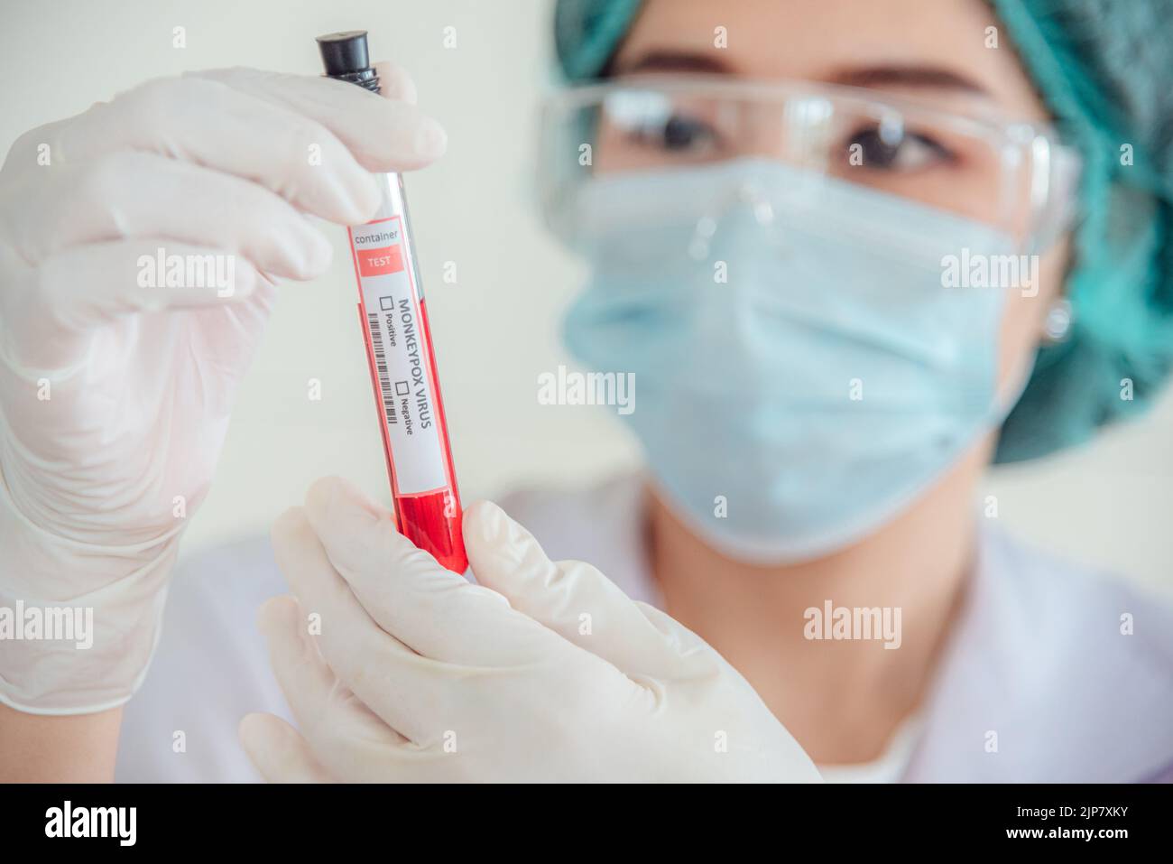 A doctor or scientist is holding an antigen blood testing tube for ...