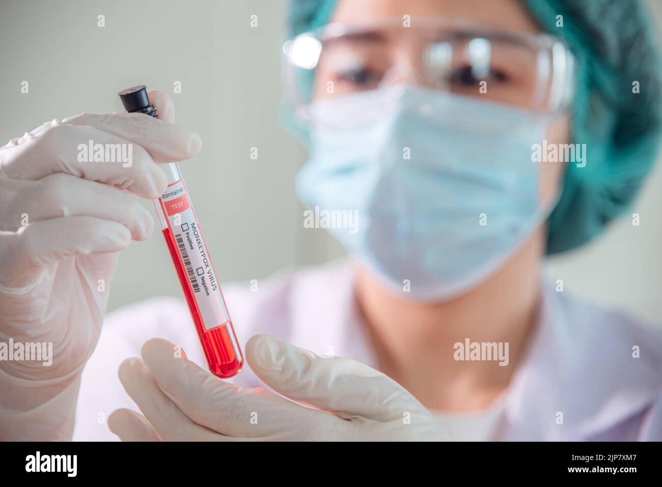 A doctor or scientist is holding an antigen blood testing tube for ...