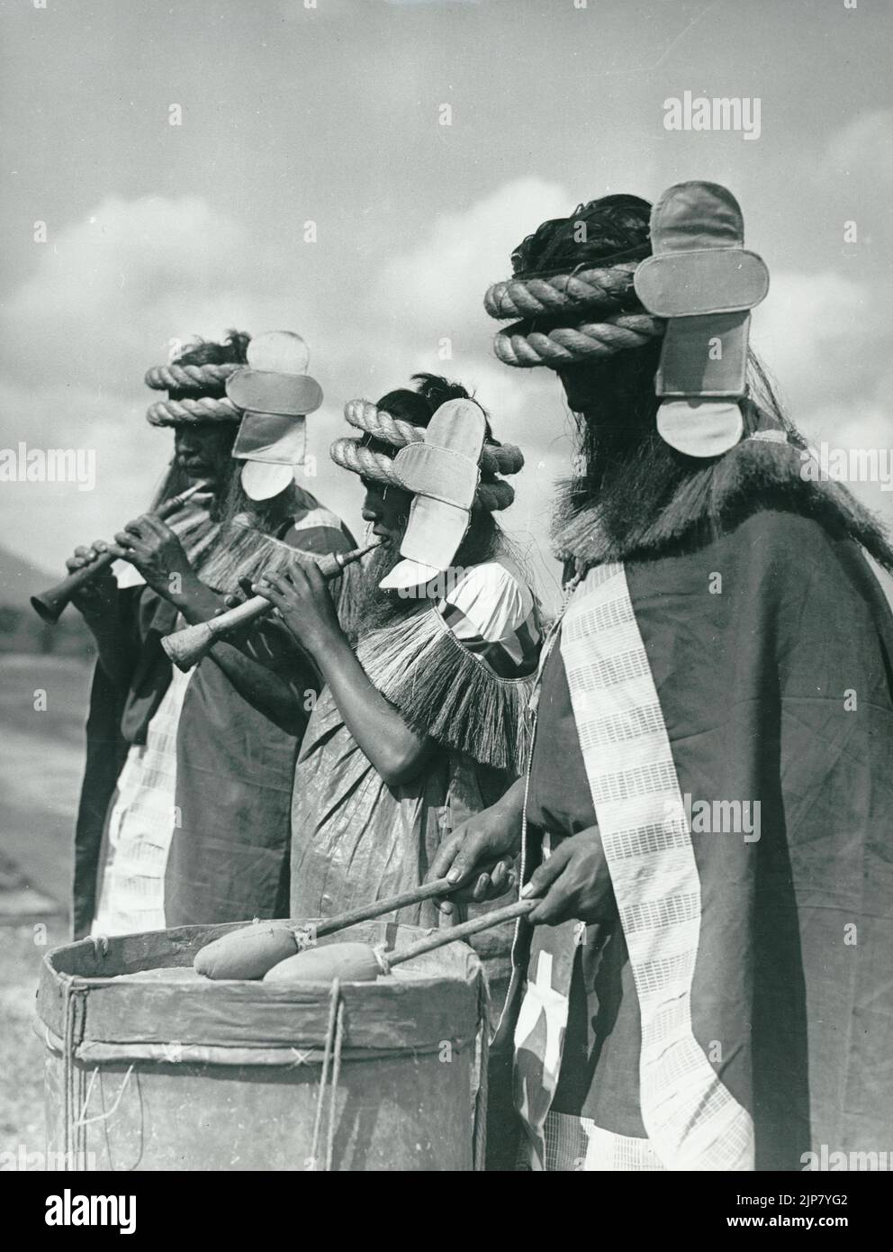 Musicians wearing costumes at an Aztec Creation of the Fifth Sun ...