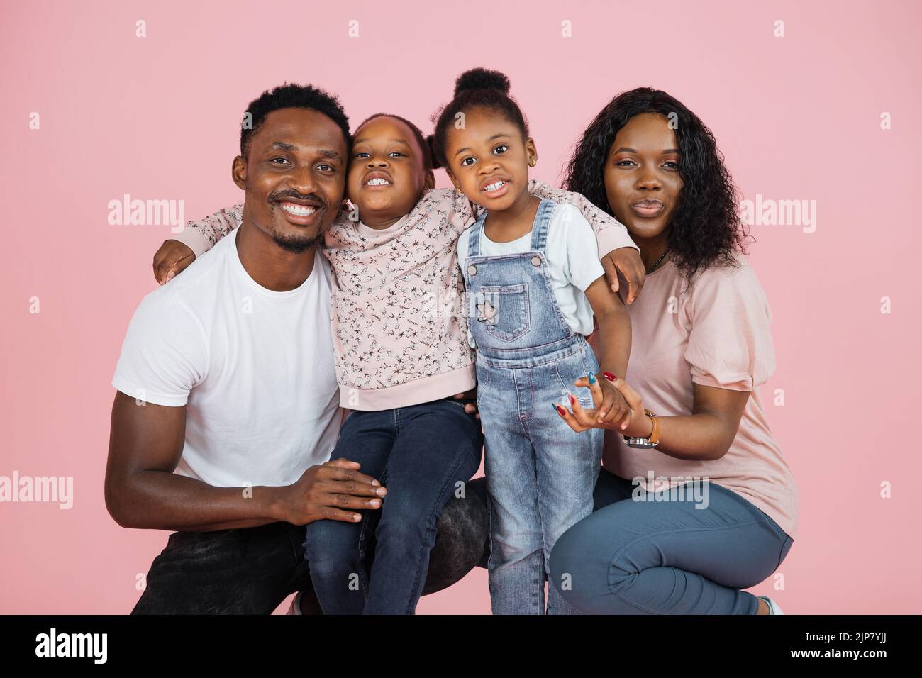 Mother father two daughters studio hi-res stock photography and images ...