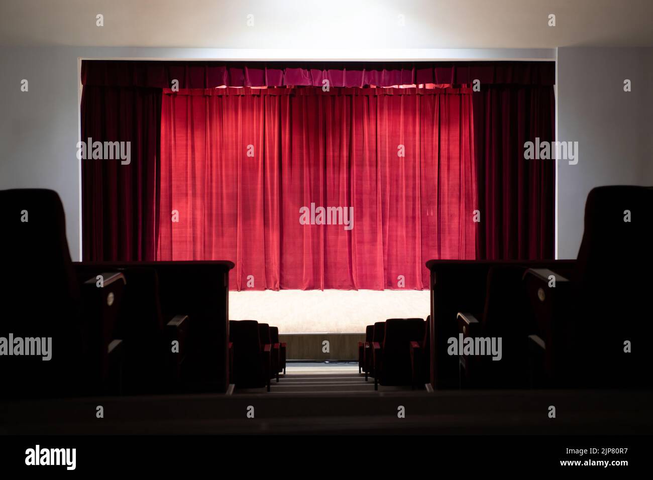 Theater curtain and stage with dramatic lighting Stock Photo - Alamy
