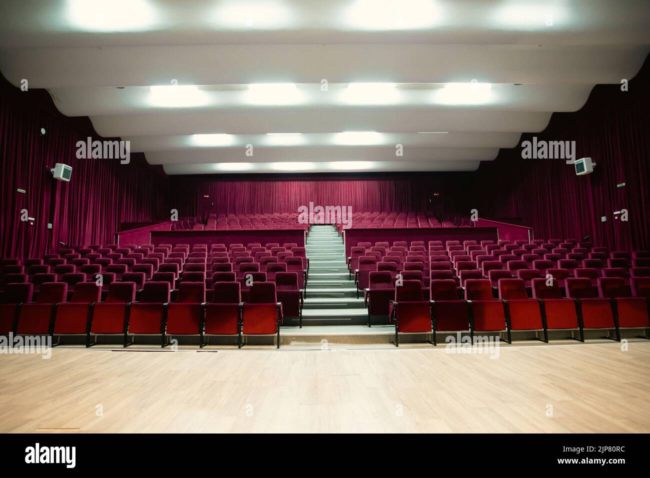 Empty cinema hall with red seats amd stage. Movie theatre Stock Photo ...