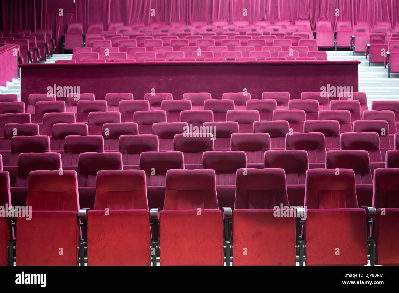 Empty cinema hall with red seats. Movie theatre Stock Photo - Alamy