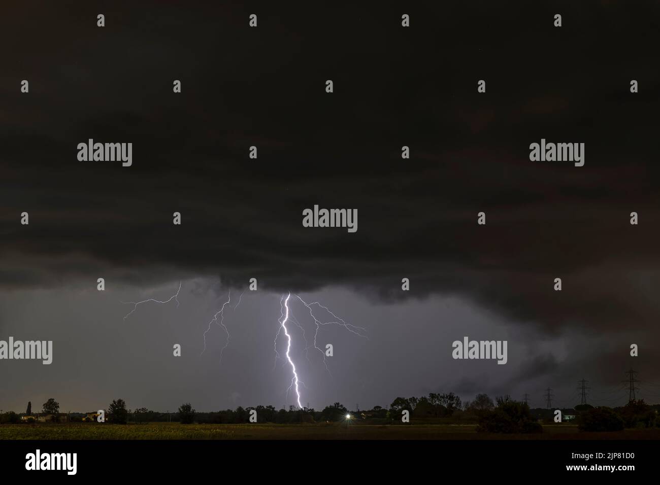 A summer storm with large lightnings over the Tuscan countryside of ...