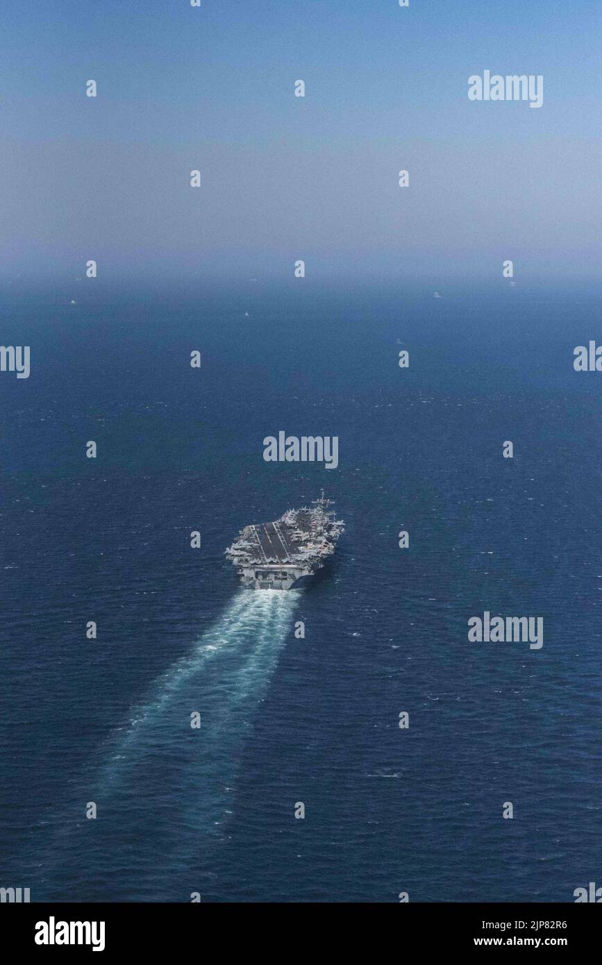 The ship and its carrier strike group are conducting naval operations ...