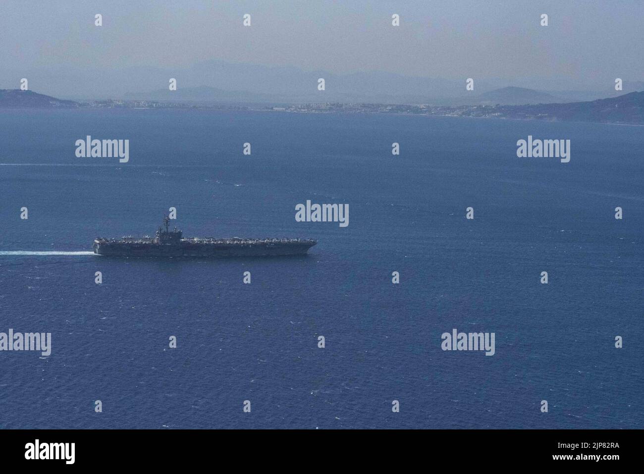 The ship and its carrier strike group are conducting naval operations ...