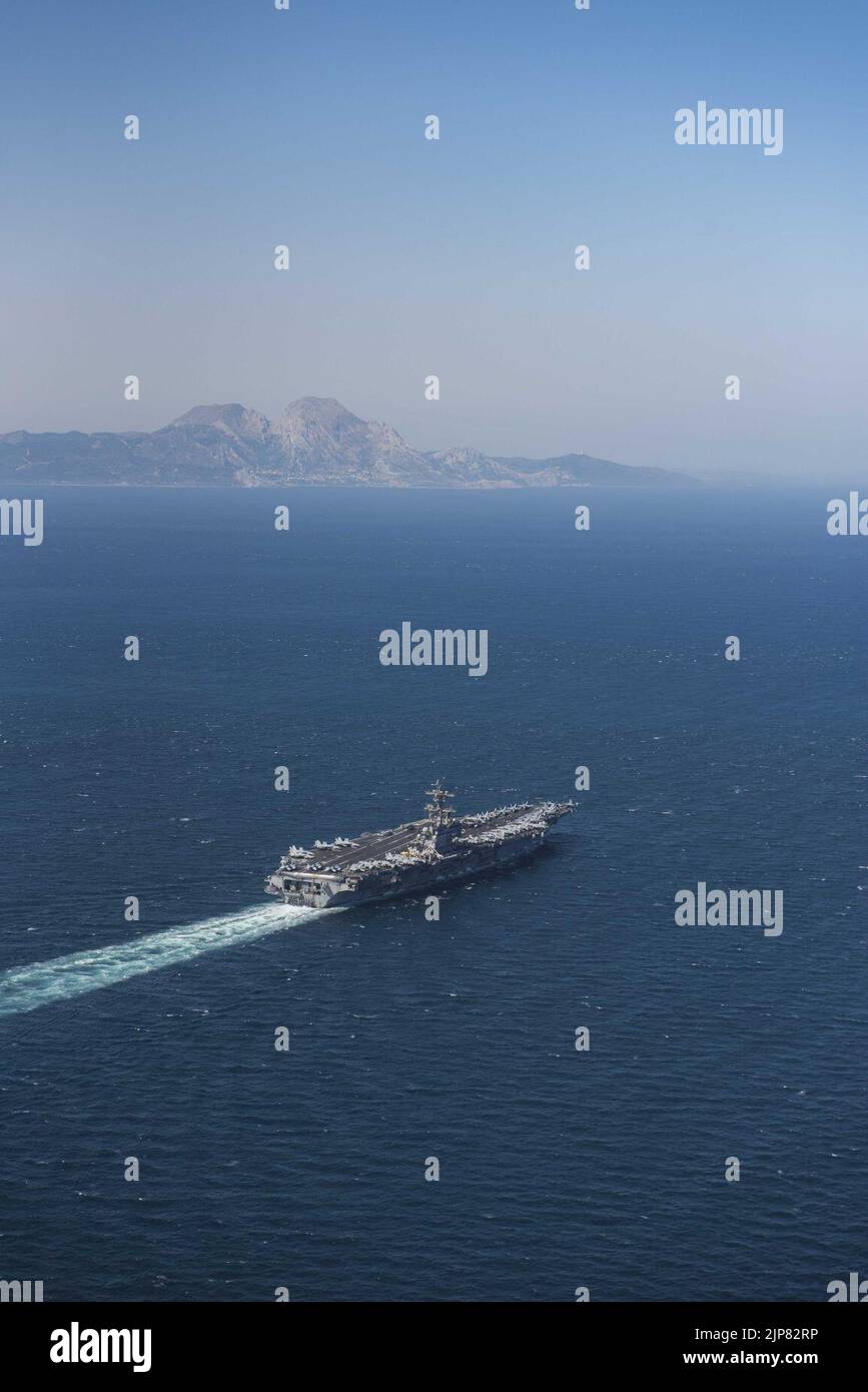 The ship and its carrier strike group are conducting naval operations ...