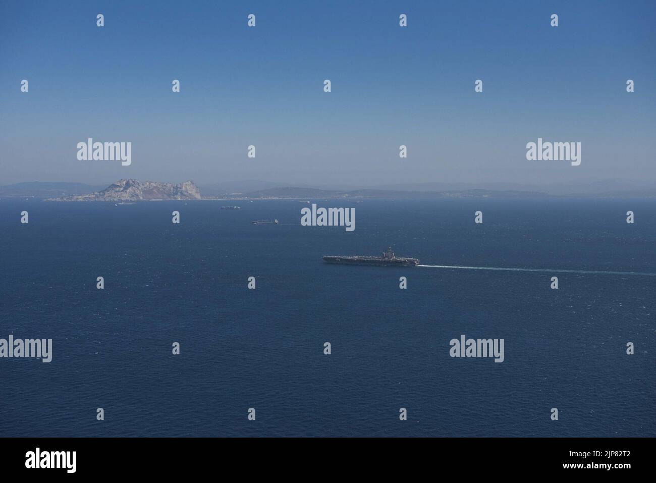 The ship and its carrier strike group are conducting naval operations ...