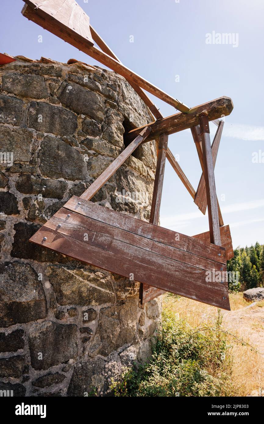 Abandoned windmill with wood blades in Santiago's road. These were ...