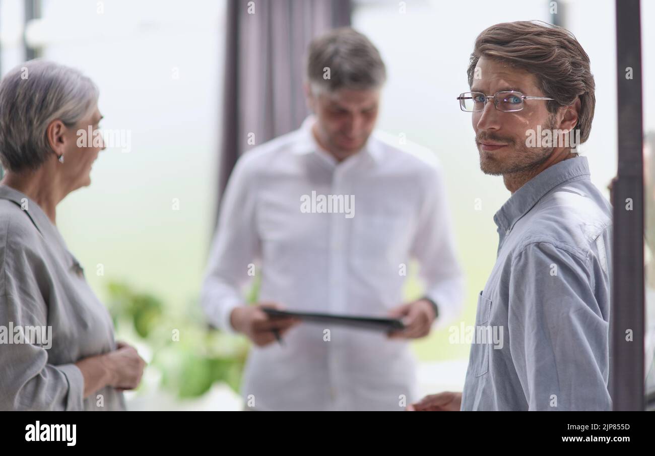 Conversation between managers and employees in the office Stock Photo ...