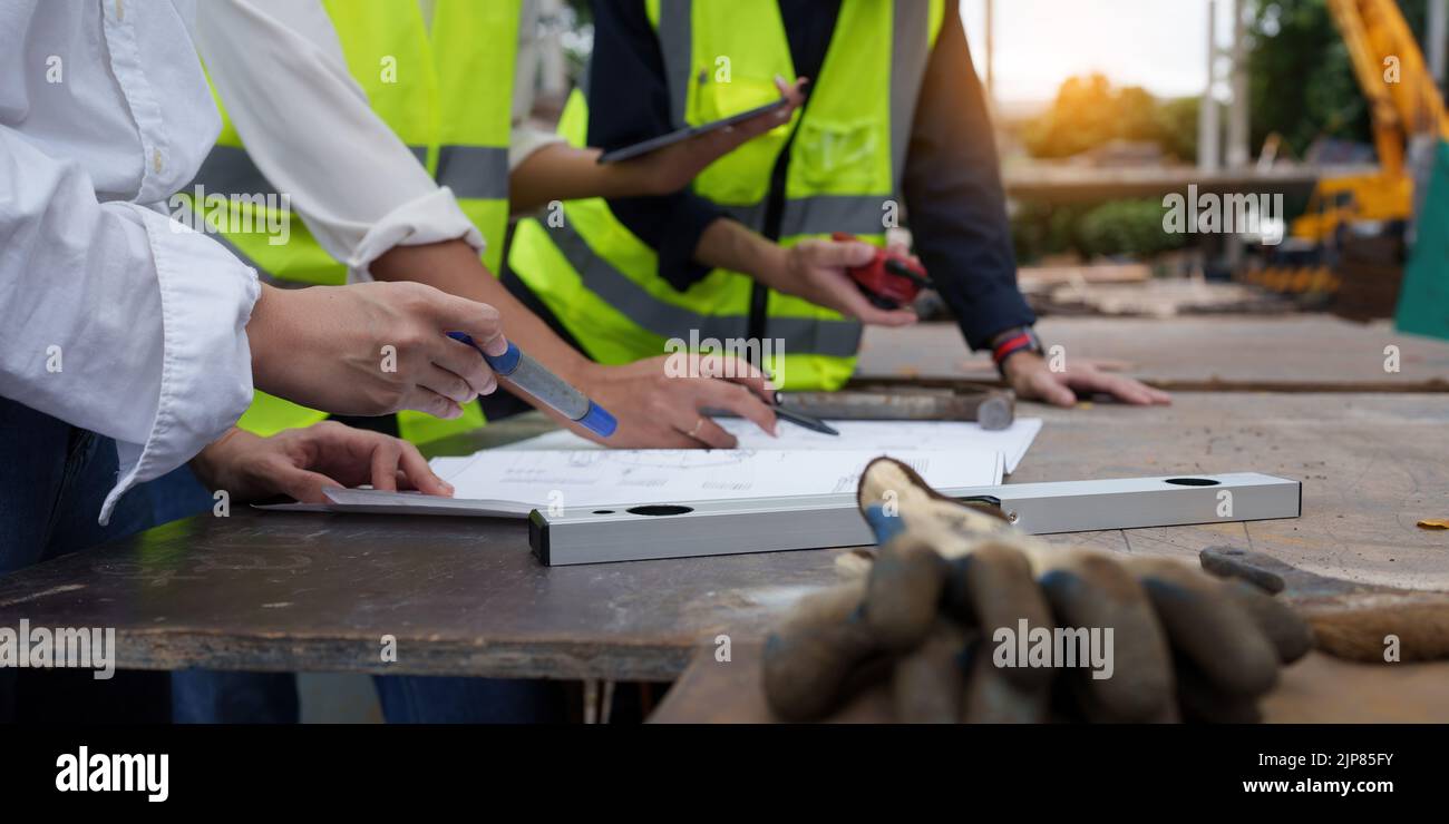 Structural engineer and architect discussing and working with ...