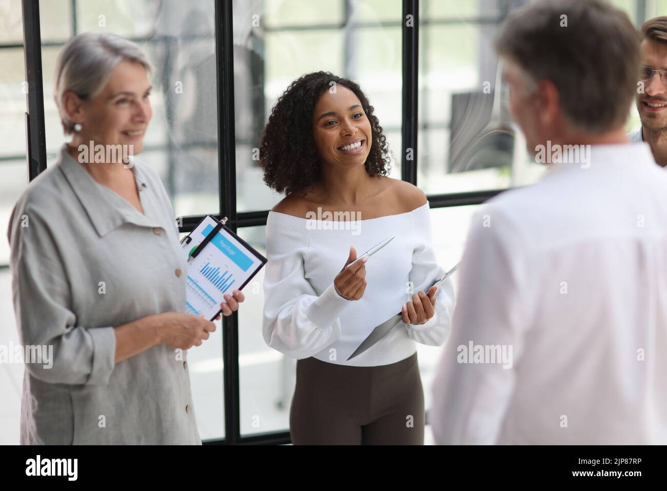Conversation between managers and employees in the office Stock Photo ...