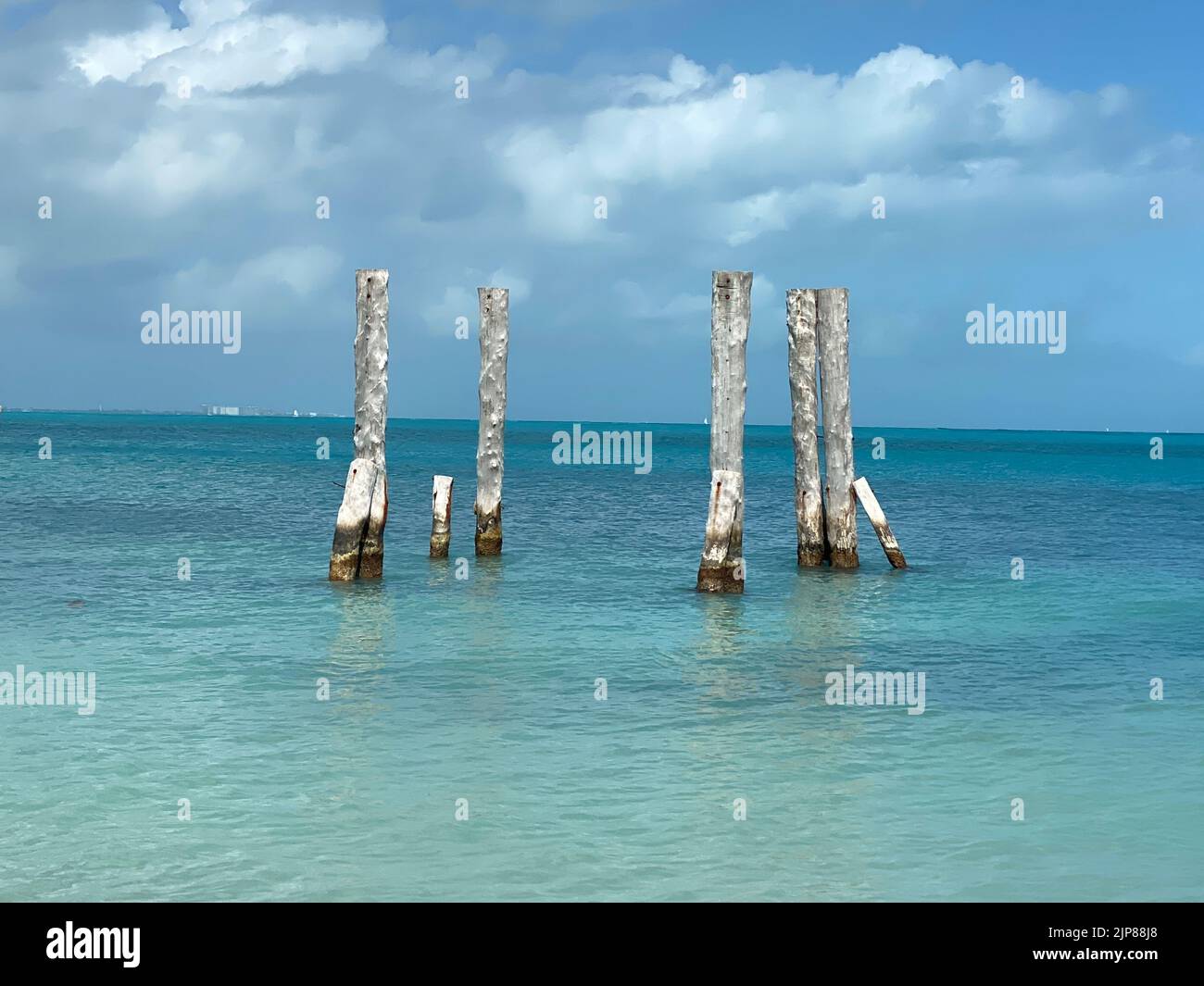 Wooden columns in the water in Cancun Caribbean Waters Sea Stock Photo ...