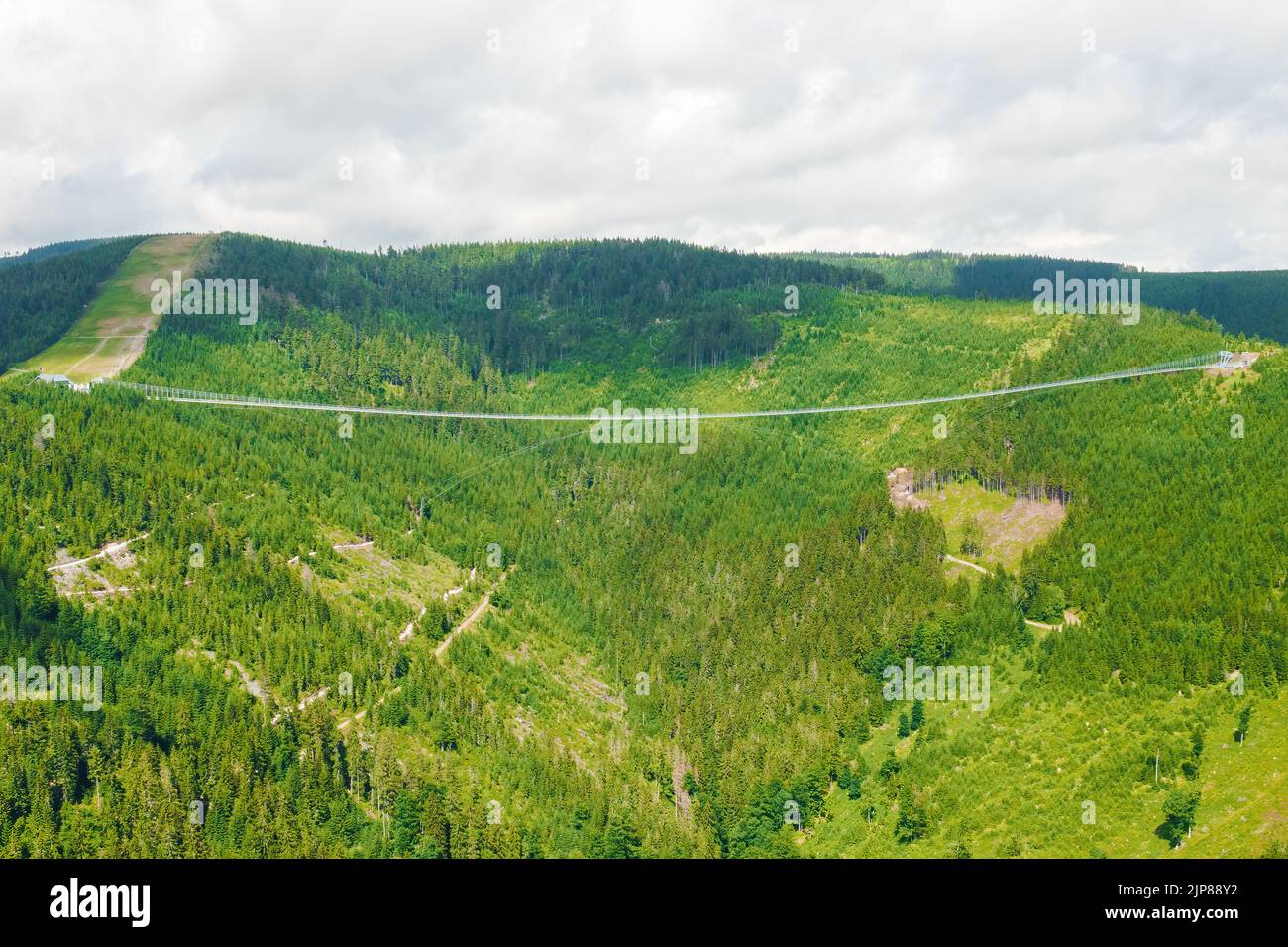 Aerial view of suspension Sky Bridge 721 and observation tower in ...