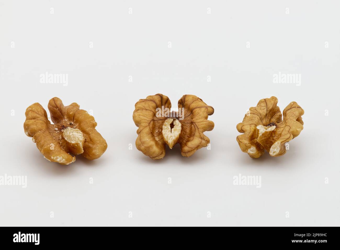 Three walnuts isolated on white background. Food texture concept Stock ...