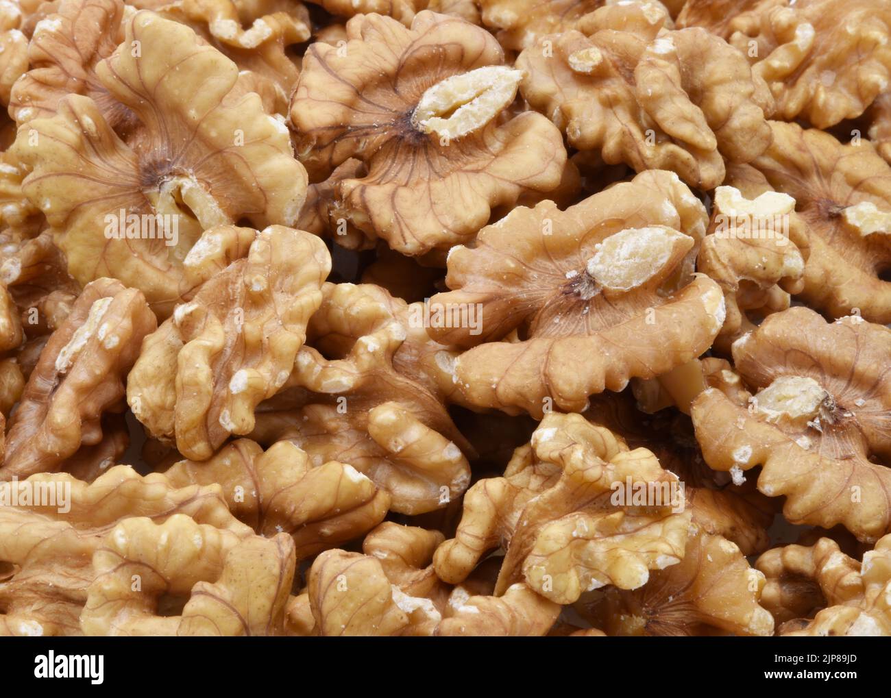 Lot of walnuts background. Food texture concept Stock Photo - Alamy