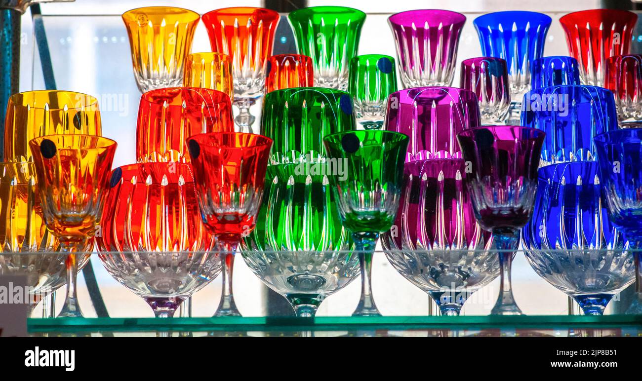 display of Backlit coloured glasses in yellow, orange, red, purple ...
