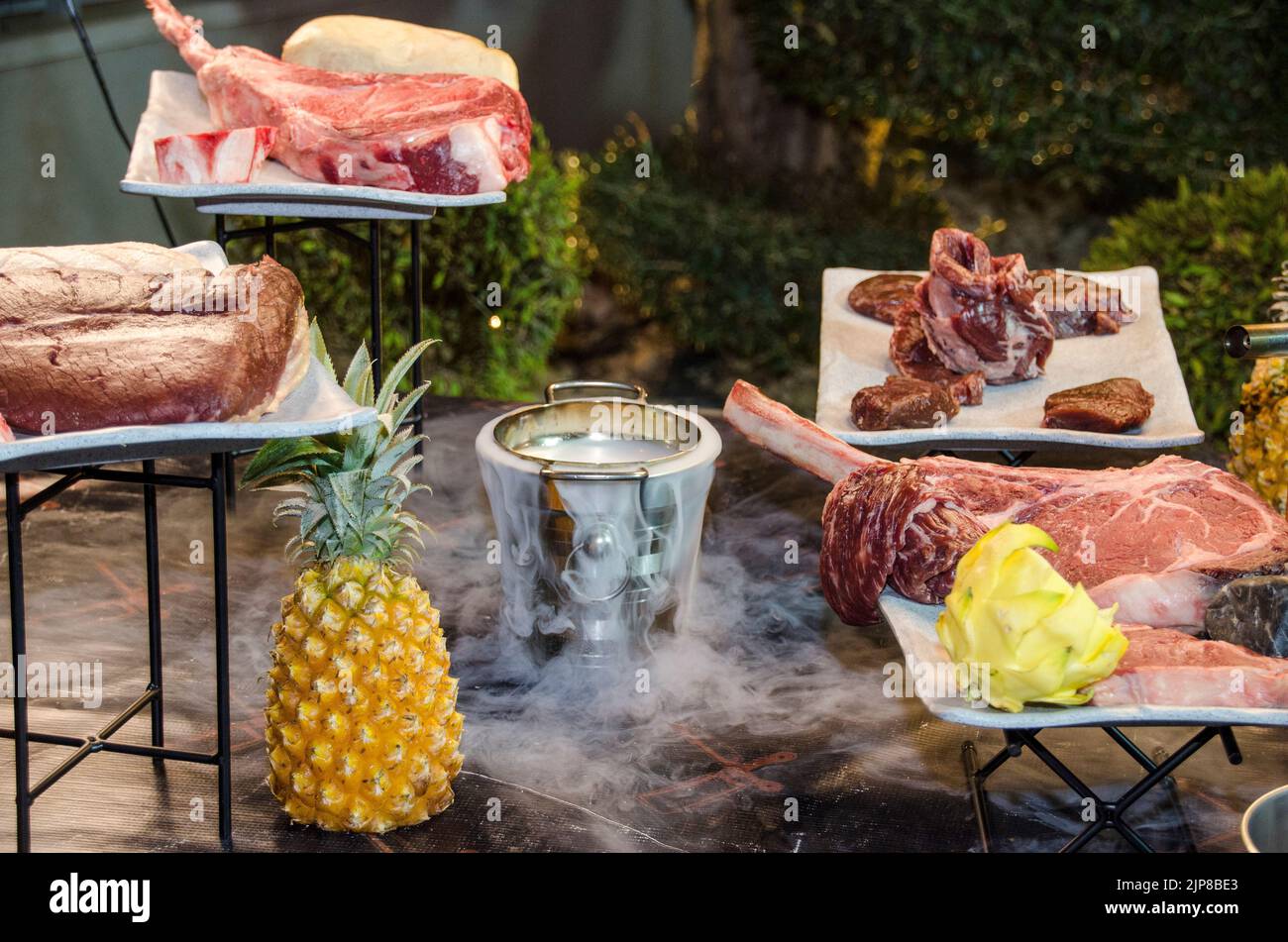 Cuts of Raw Meat on display at a posh buffet Stock Photo - Alamy