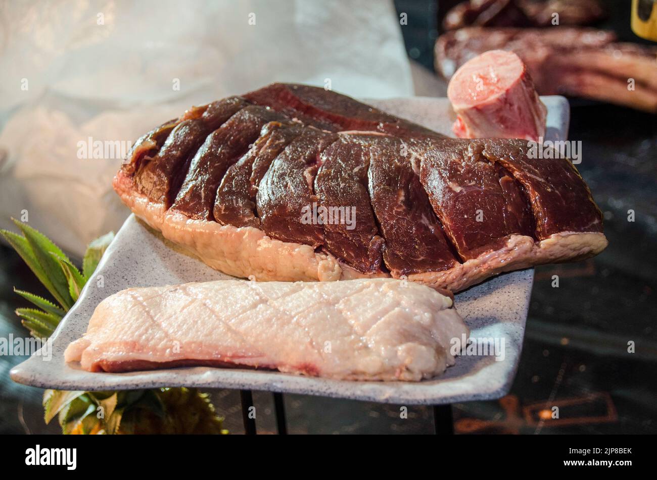 Cuts of Raw Meat on display at a posh buffet Stock Photo - Alamy
