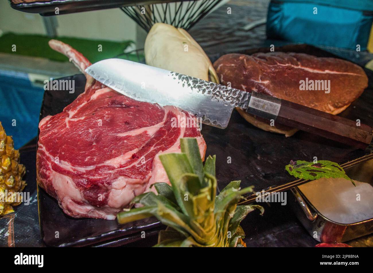 Cuts of Raw Meat on display at a posh buffet Stock Photo - Alamy