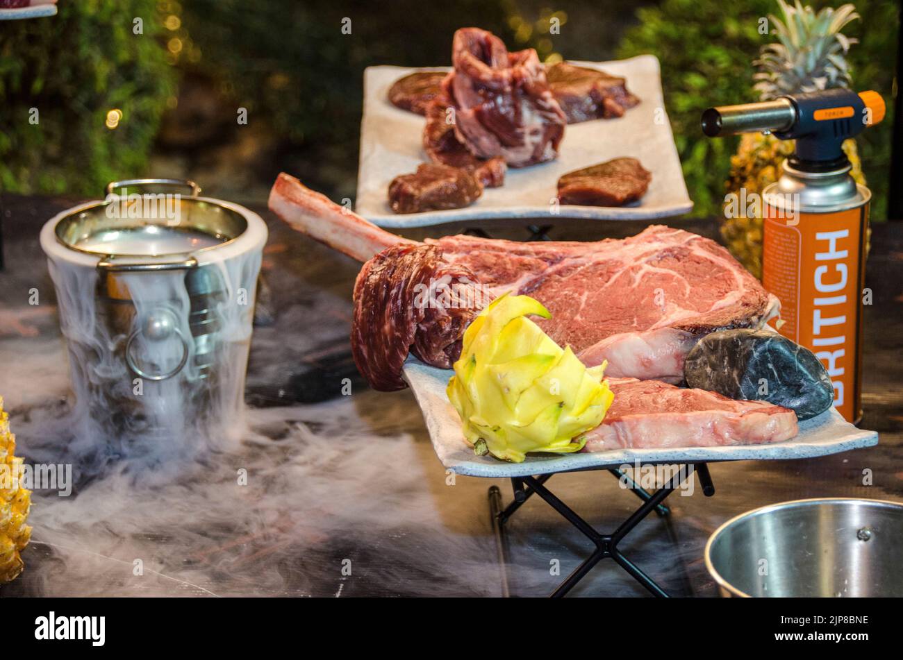 Cuts of Raw Meat on display at a posh buffet Stock Photo - Alamy