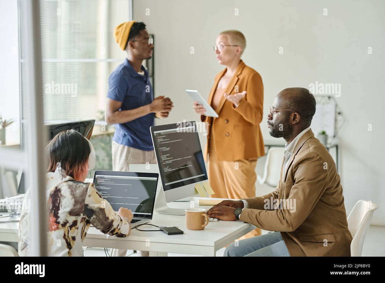 Team programmers writing digital hi-res stock photography and images ...
