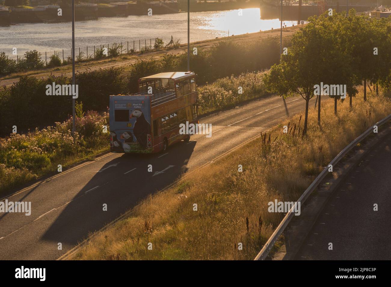 Glasgow Tour sightseeing bus travelling along the Clydeside Expressway ...