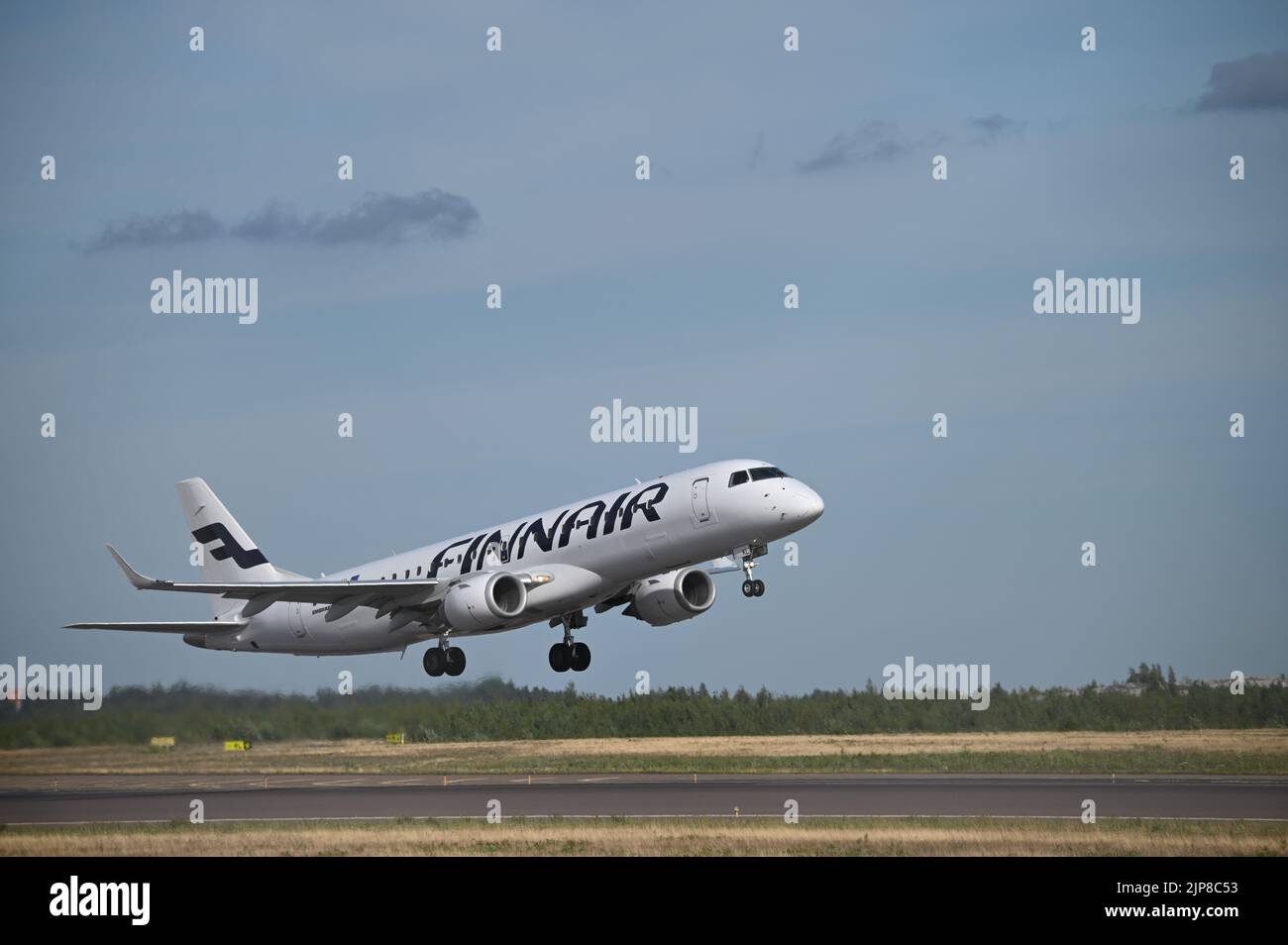 The Finnair Embraer ERJ-190 taking off at Helsinki-Vantaa airport Stock ...
