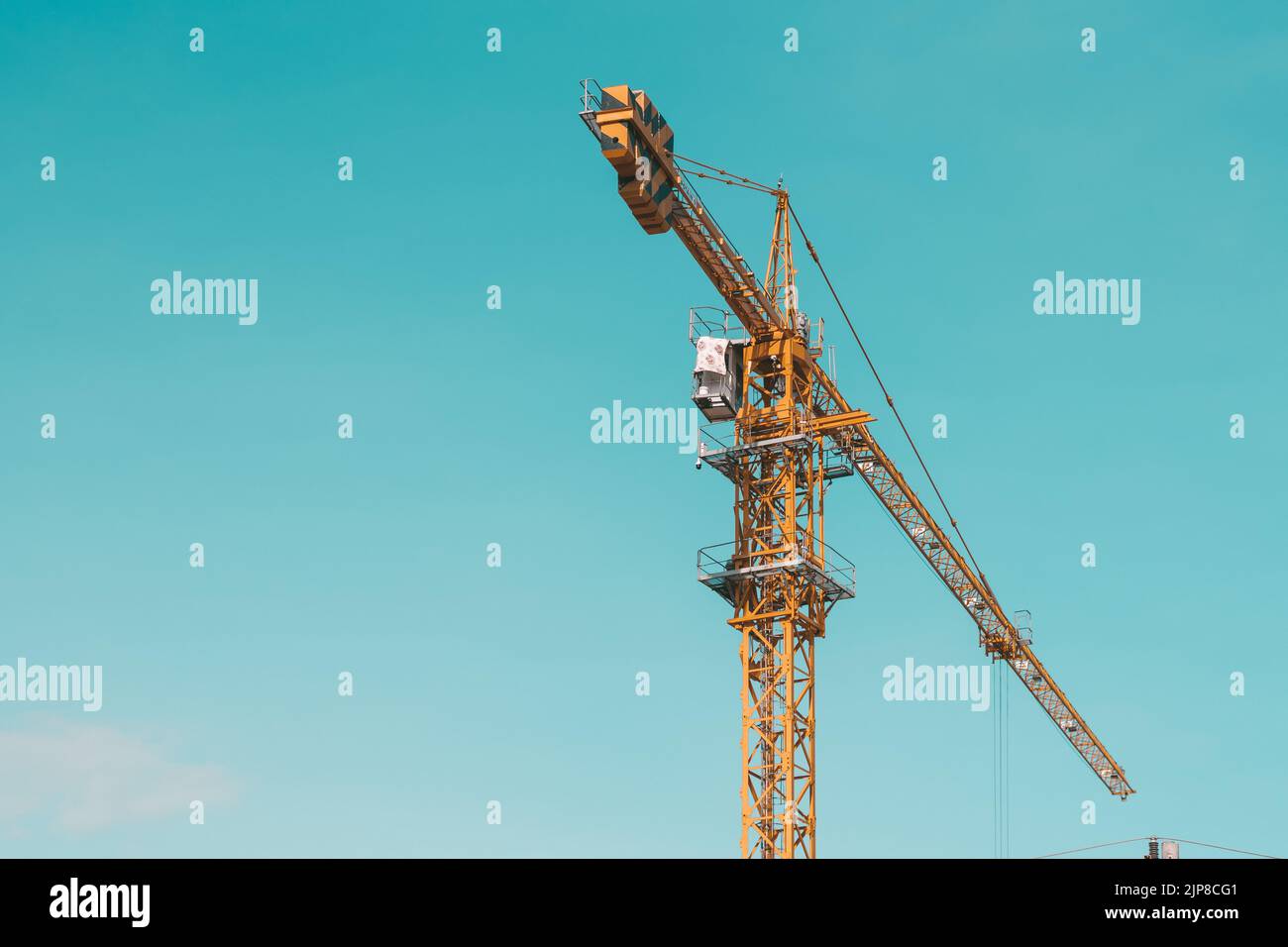Tower Crane lattice boom hook clear blue sky sun background ...