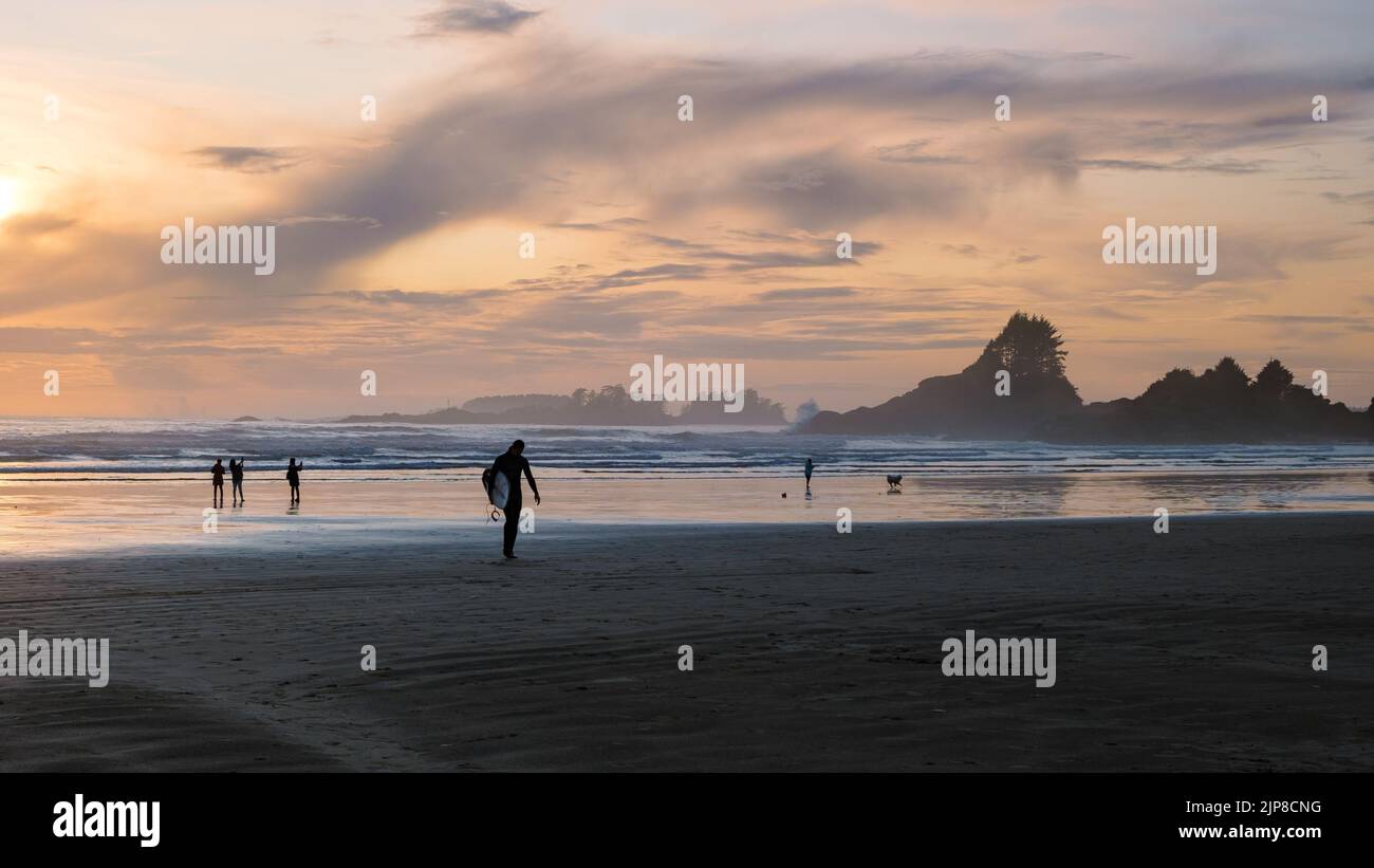 Tofino Vancouver Island Pacific rim coast, surfers with surfboard ...