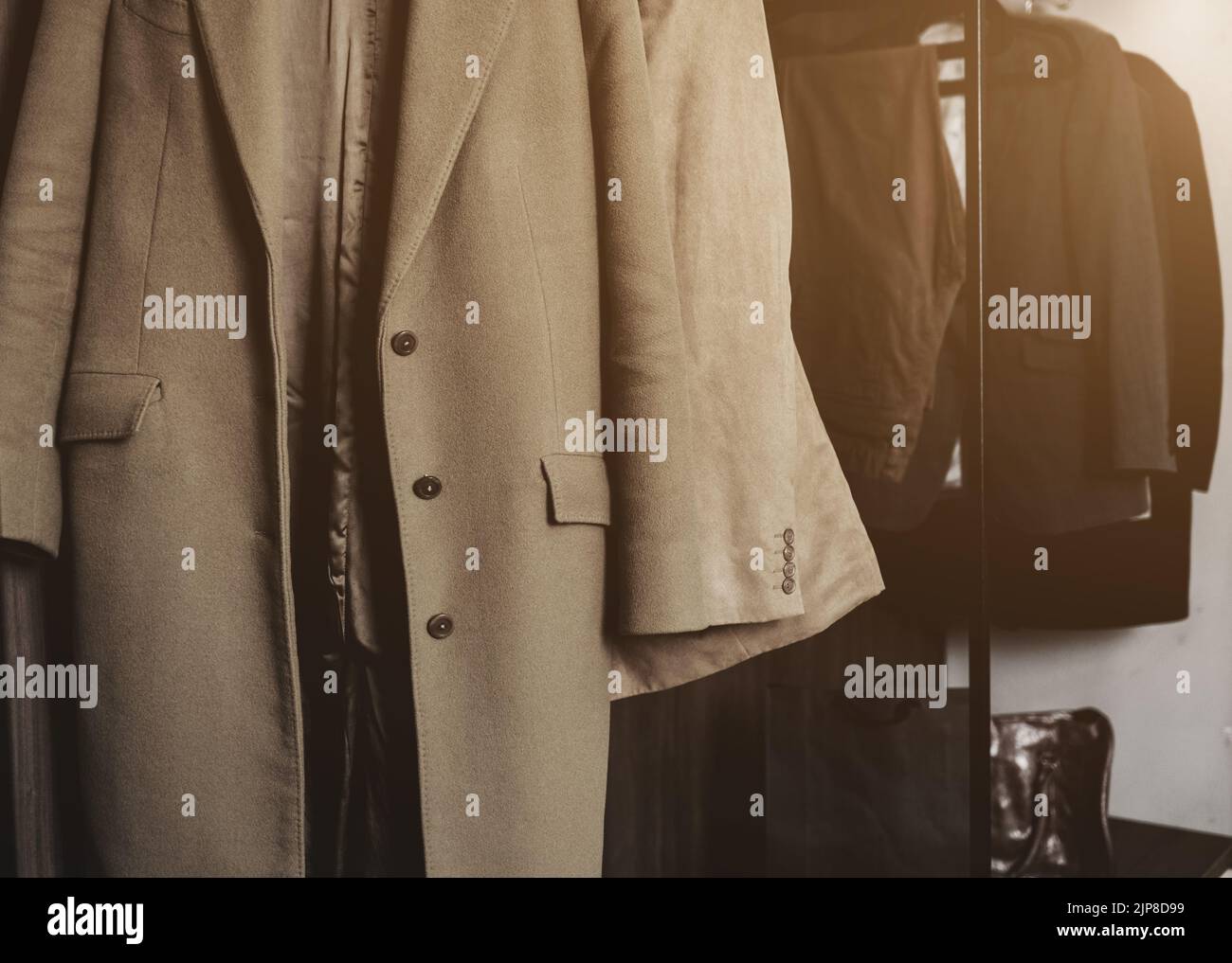 Row of fashion clothes of different colors clothing on hangers. Retail ...