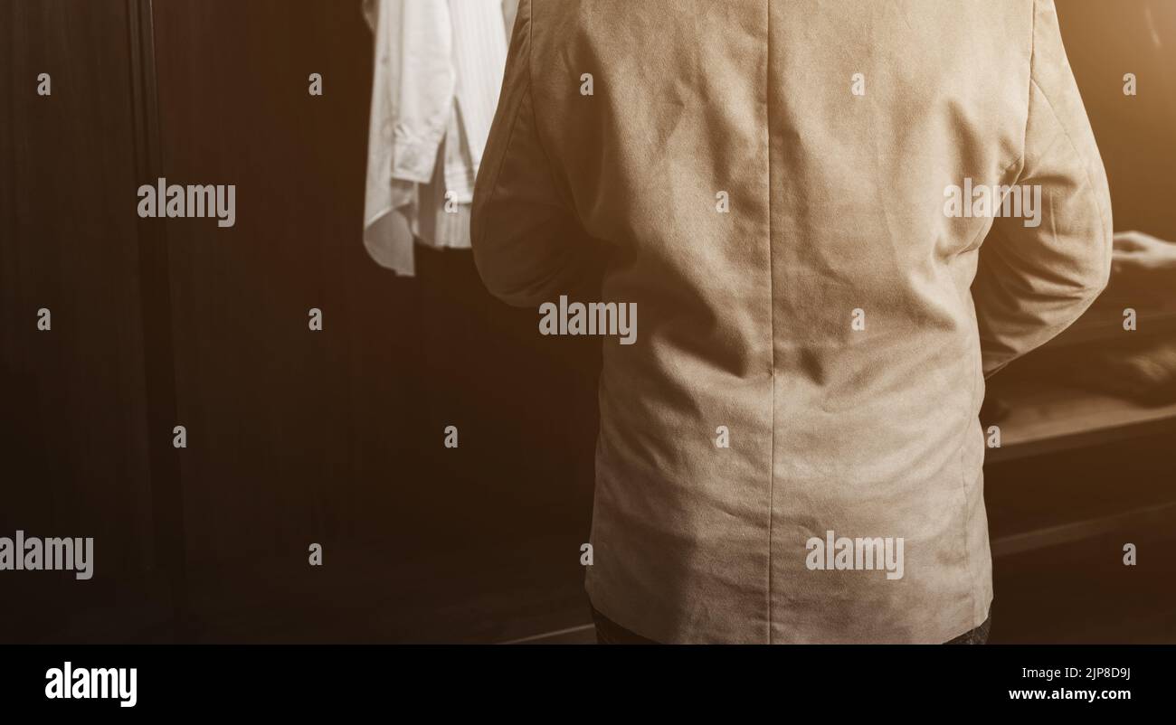 back view of a man in suit standing in room. men's fashion Stock Photo ...
